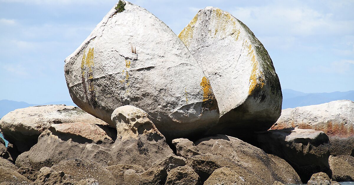Split Apple Rock in Tasman, New Zealand | Tripomatic
